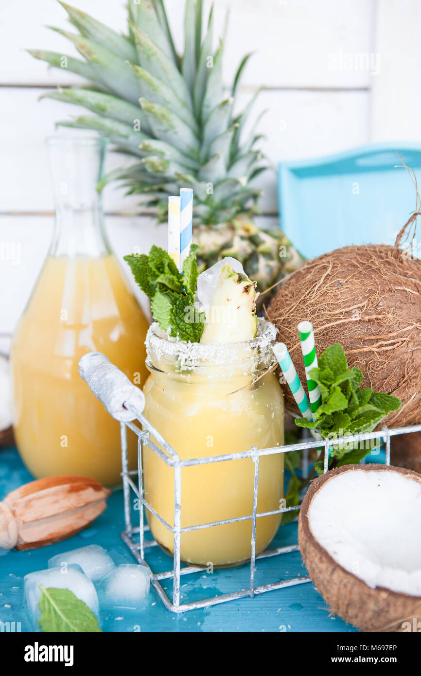 Ice cold fruity cocktail with pineapple and coconut Stock Photo - Alamy