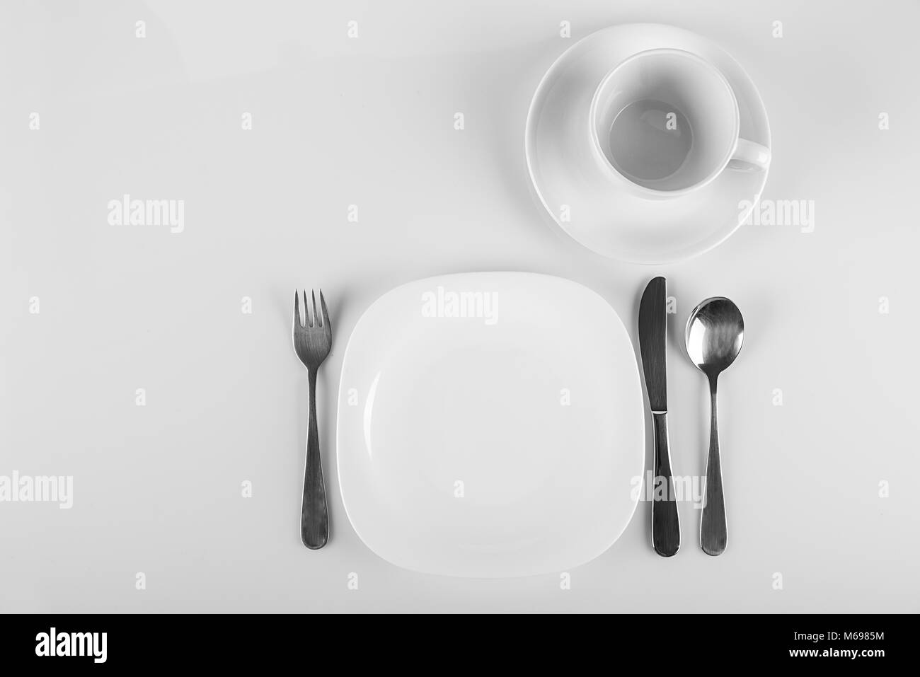 Set cups on table Black and White Stock Photos & Images - Alamy