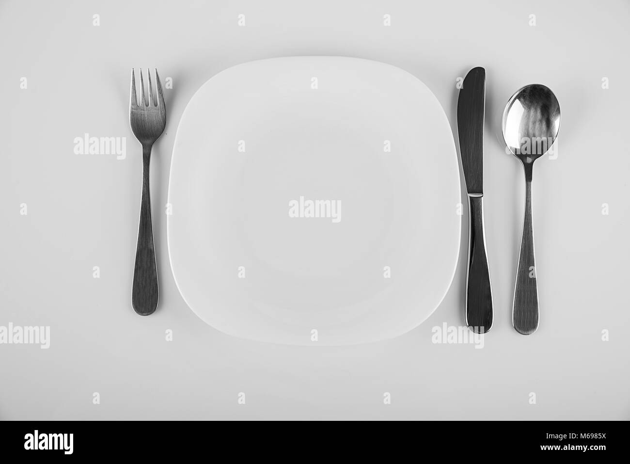 On white ceramic dishes Black and White Stock Photos & Images - Alamy