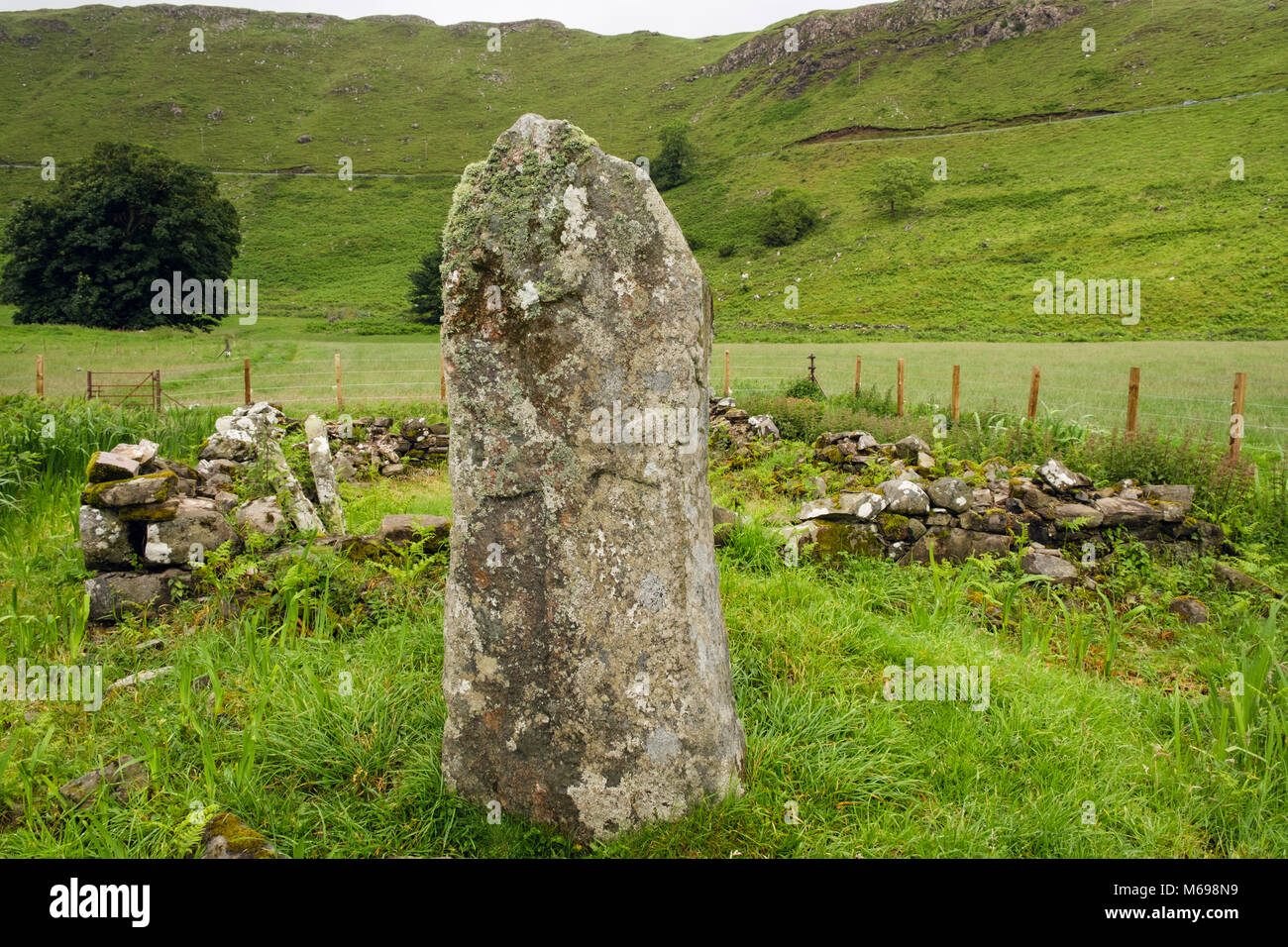 Neolithic standing stone with an early Christian cross carved on it by ...