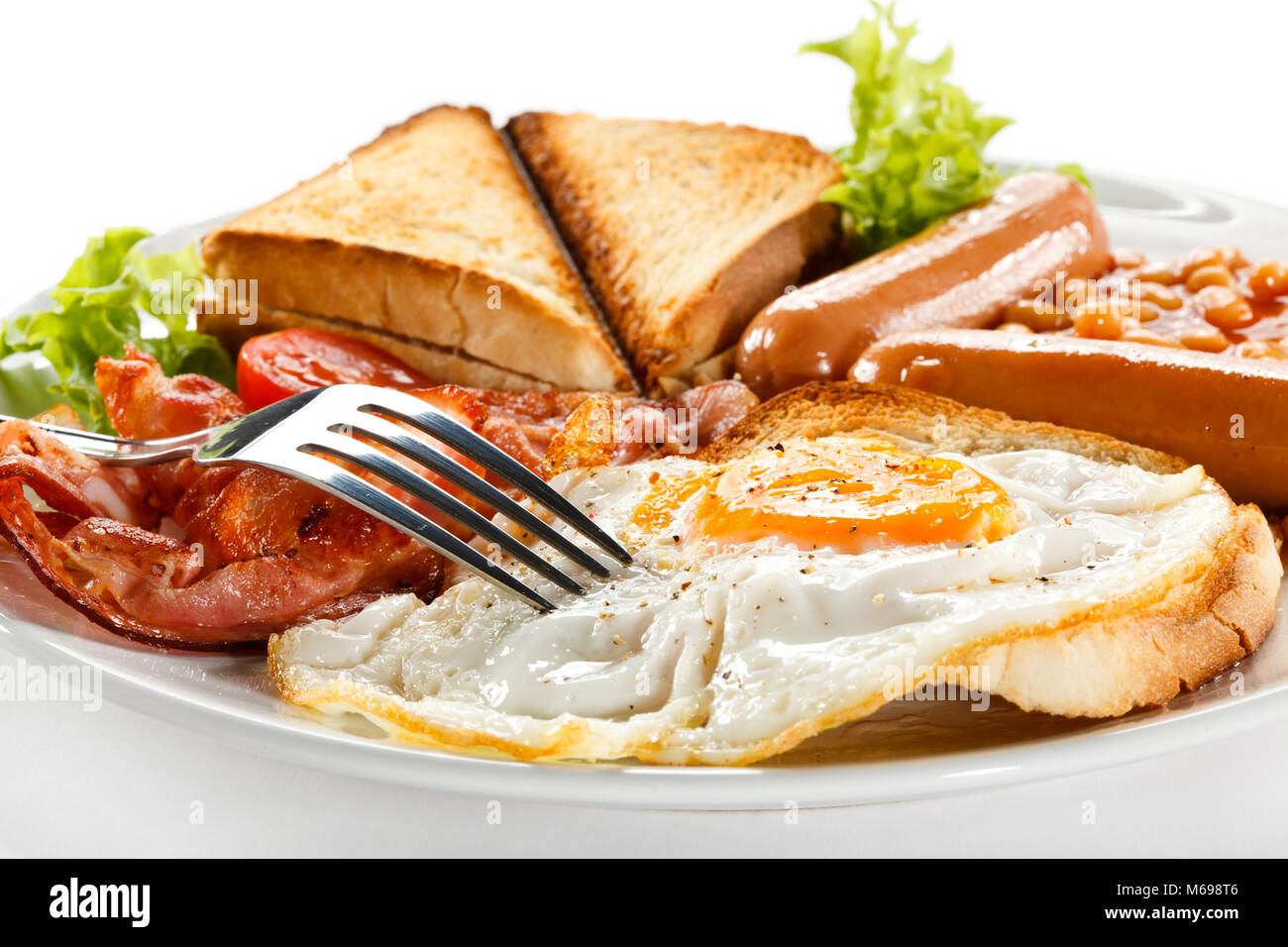 English breakfast - toast, egg, bacon and vegetables Stock Photo - Alamy