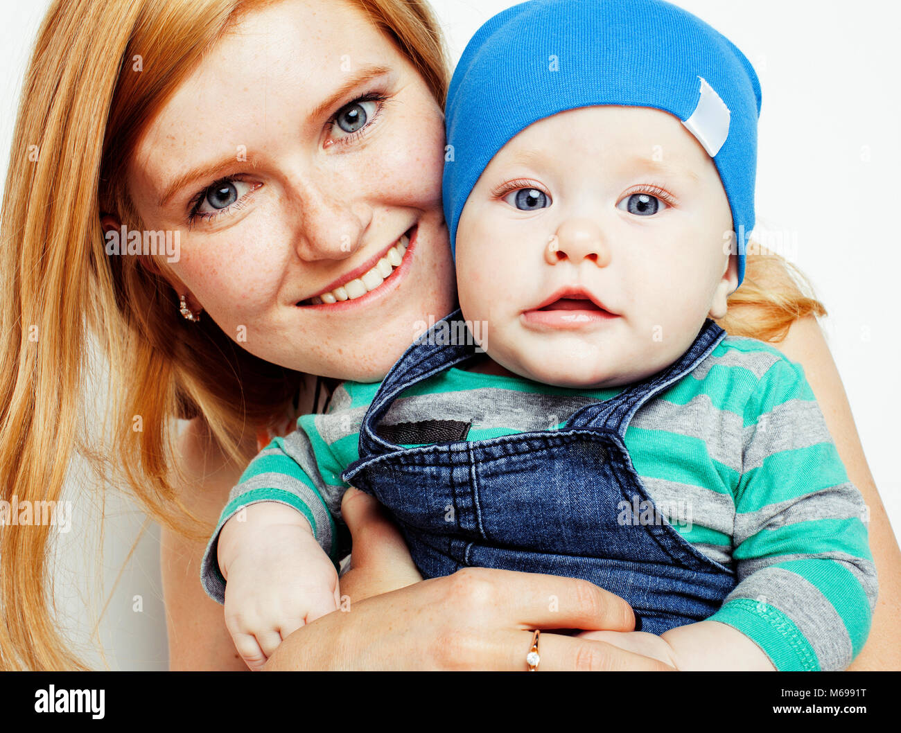young beauty mother with cute baby, red head happy modern family ...