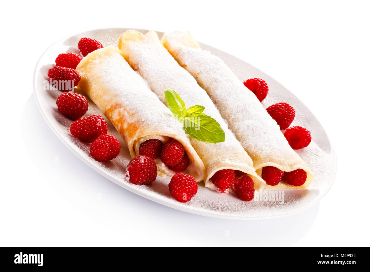 Crepes with raspberries and cream Stock Photo - Alamy