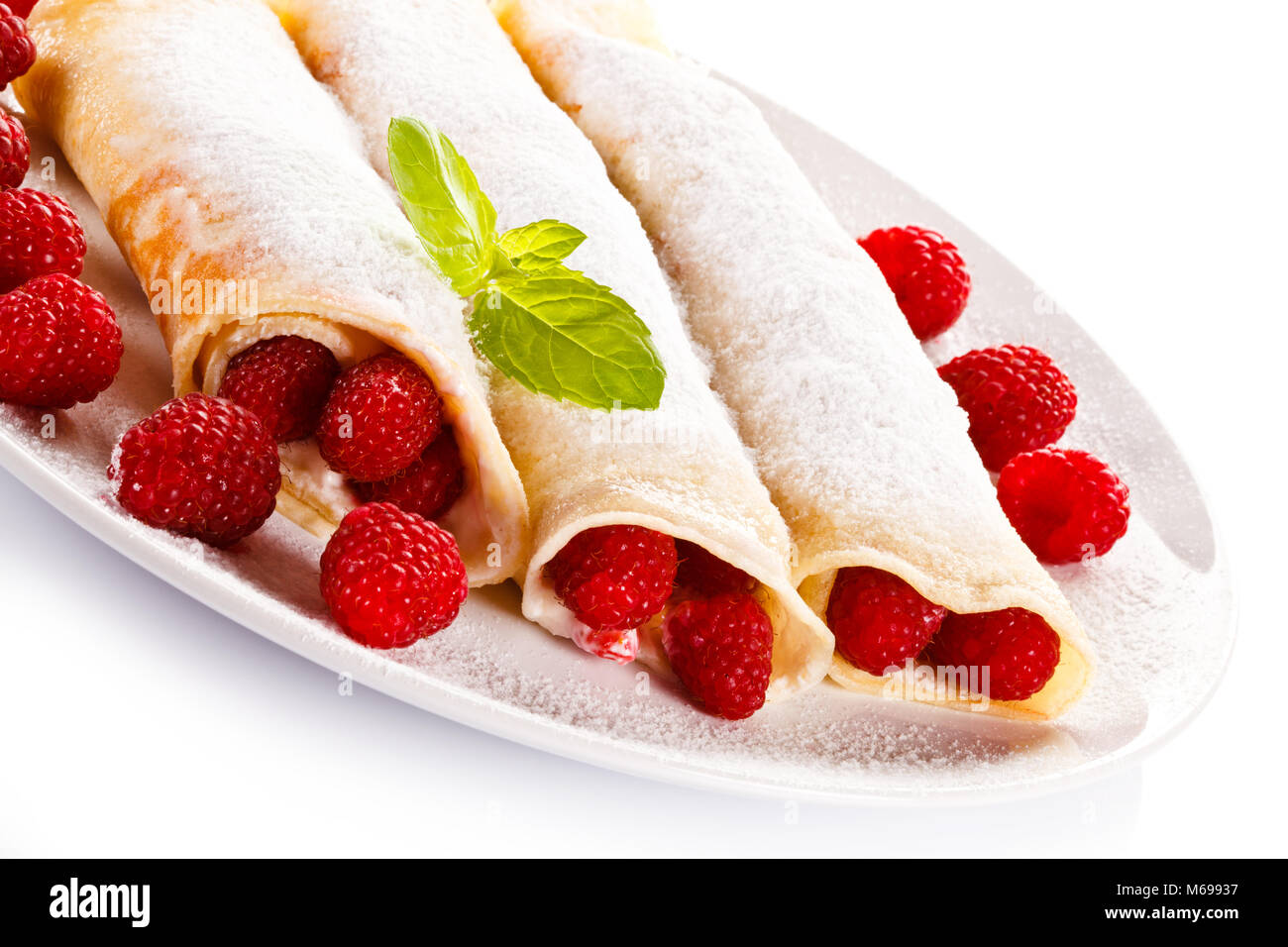 Crepes with raspberries and cream Stock Photo - Alamy