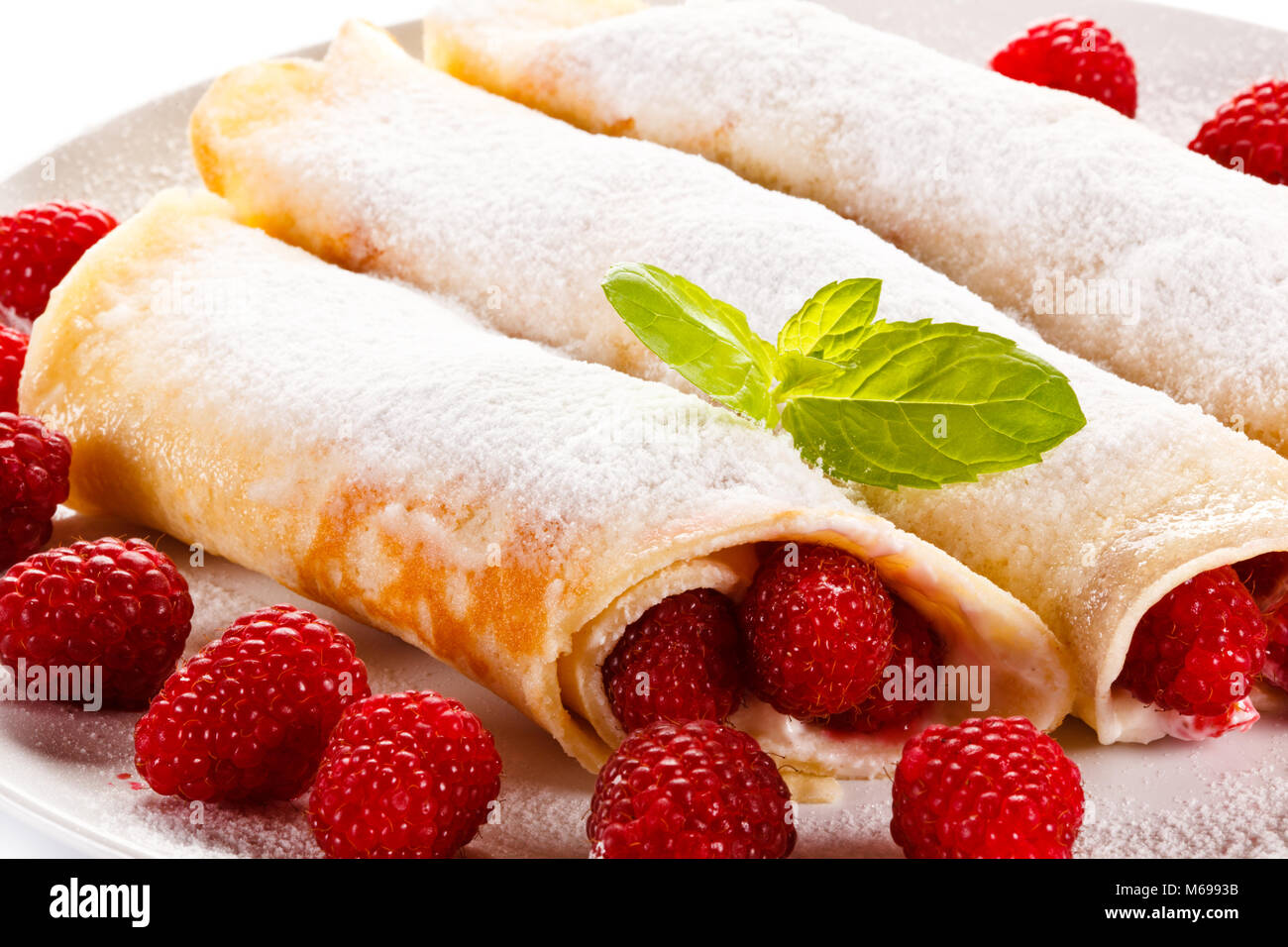 Crepes with raspberries and cream Stock Photo - Alamy