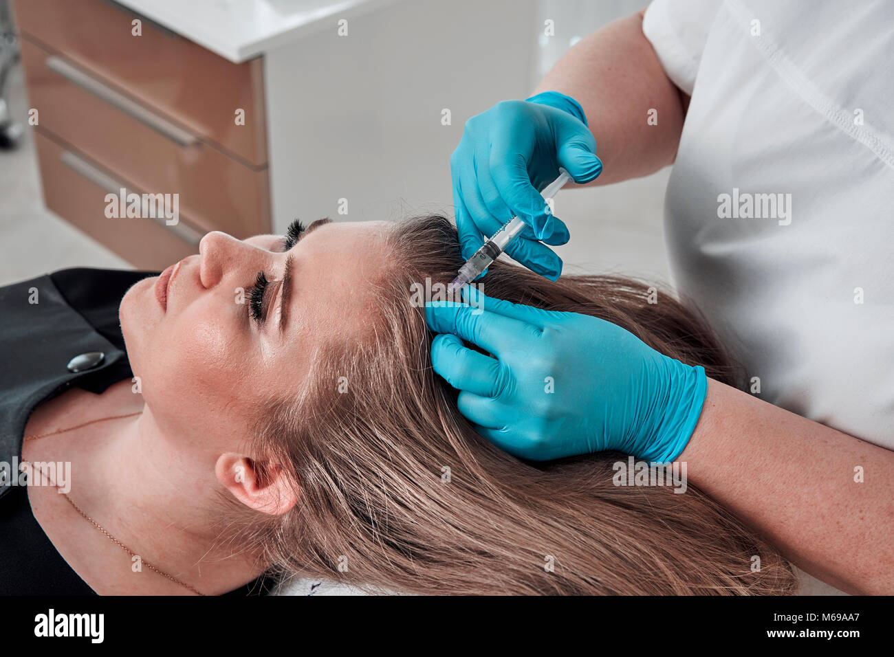 cosmetic injections to strengthen the hair Stock Photo - Alamy
