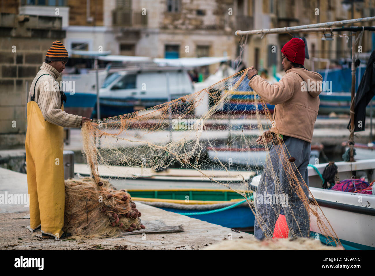 Fisherman in the port of the Marsaxlokk, Malt, Europe Stock Photo - Alamy