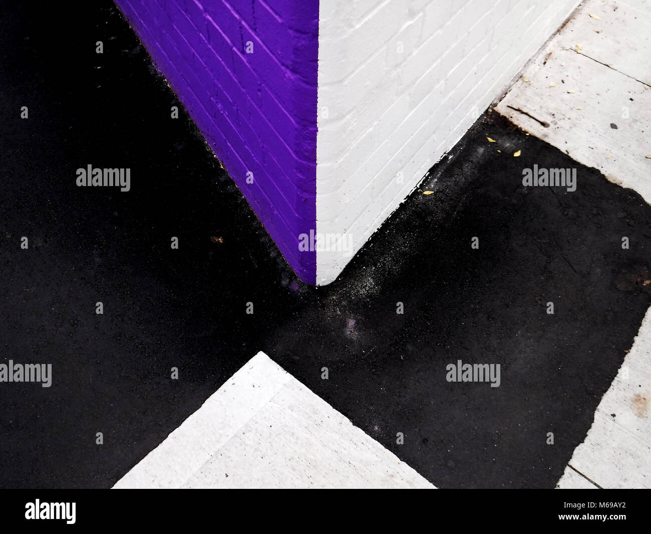 Colourful building contrasting with pavement Stock Photo - Alamy