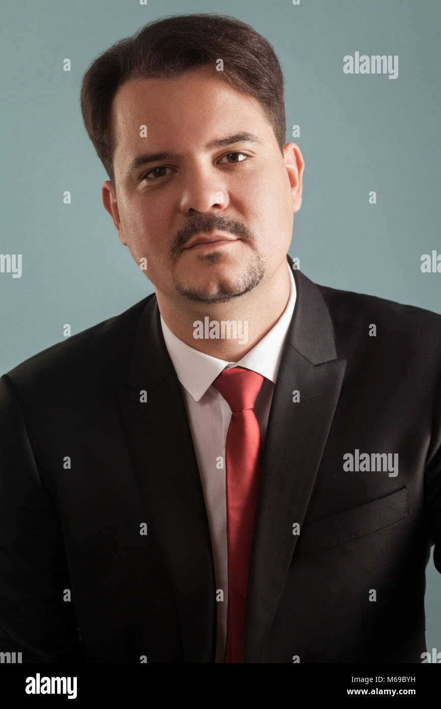 Portrait of happiness business man looking at camera. Indoor, studio ...