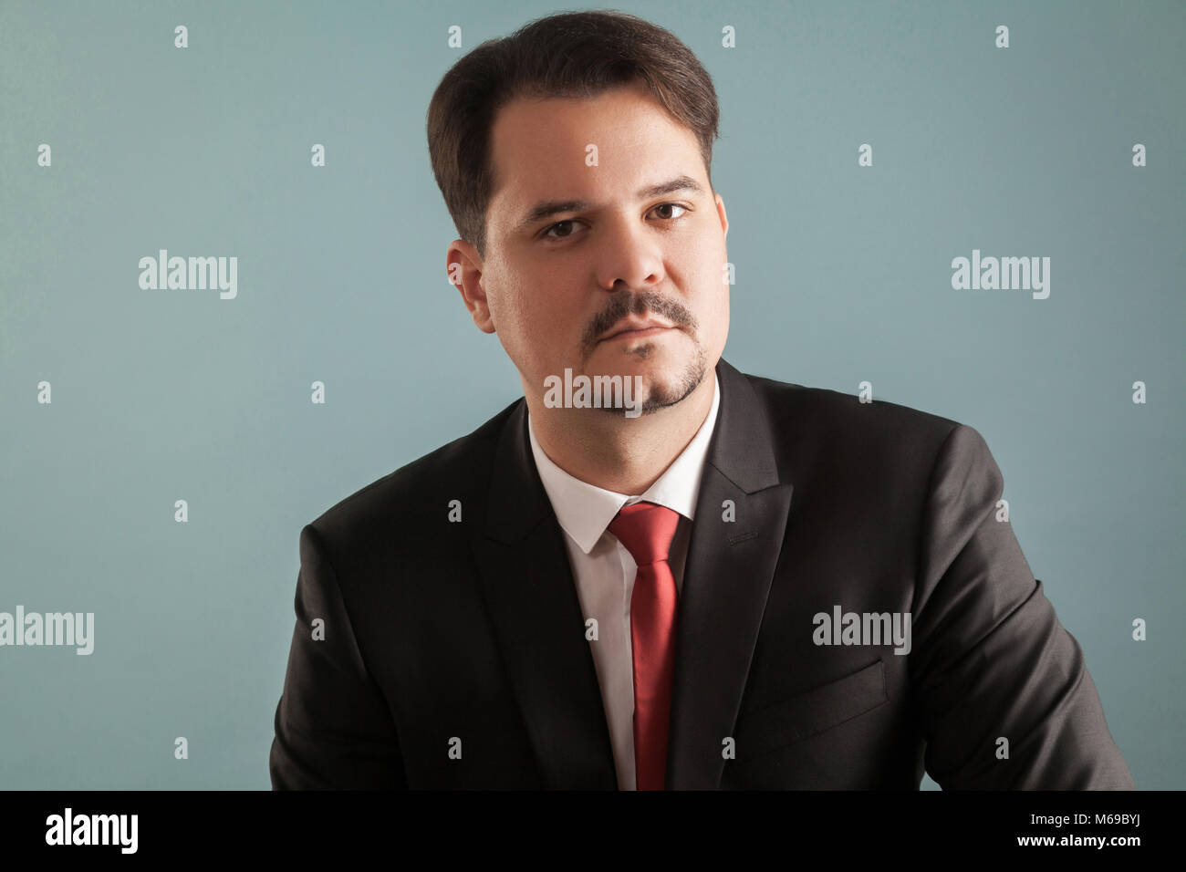 Portrait of serious boss, ceo or business man. Indoor, studio shot ...