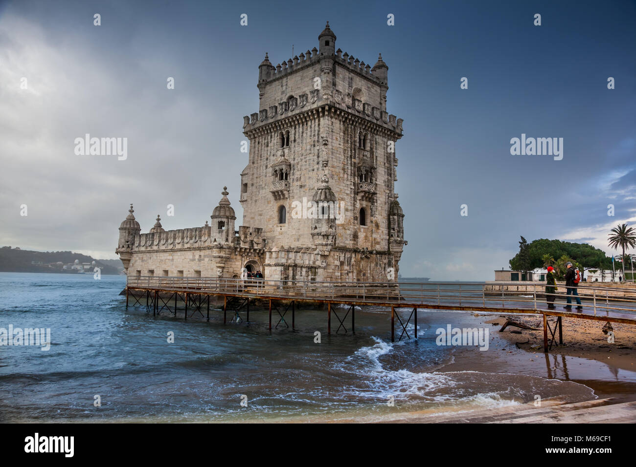 LISBON, PORTUGAL - Two unknown people speaking in front of Belem Tower ...