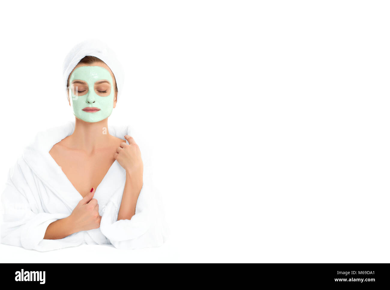 Beautiful Woman In Bathrobe Is Getting Facial Clay Mask Beauty