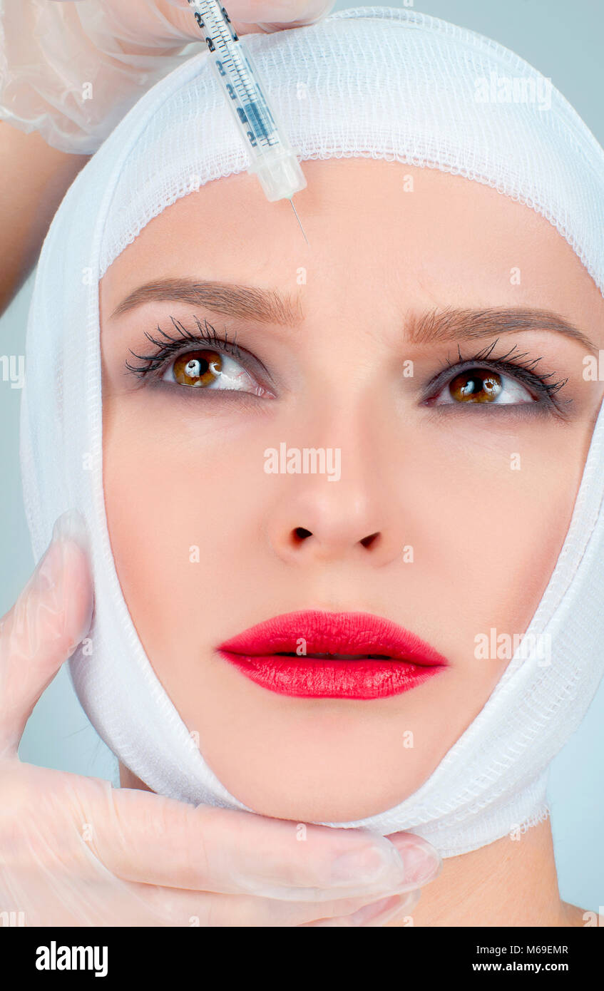 Woman get injection. Beautiful woman after plastic surgery with ...