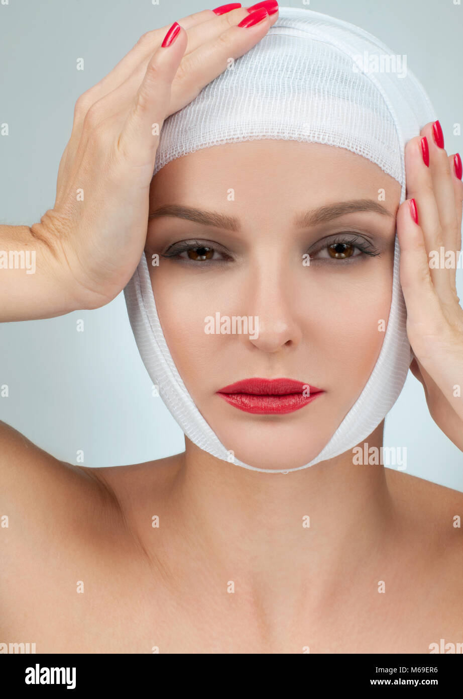Beautiful woman after plastic surgery with bandaged face. Beauty Stock ...