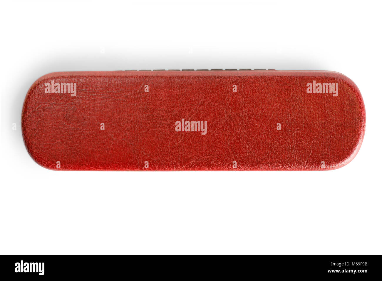 Small closed long red leather case close up. Isolated on white ...