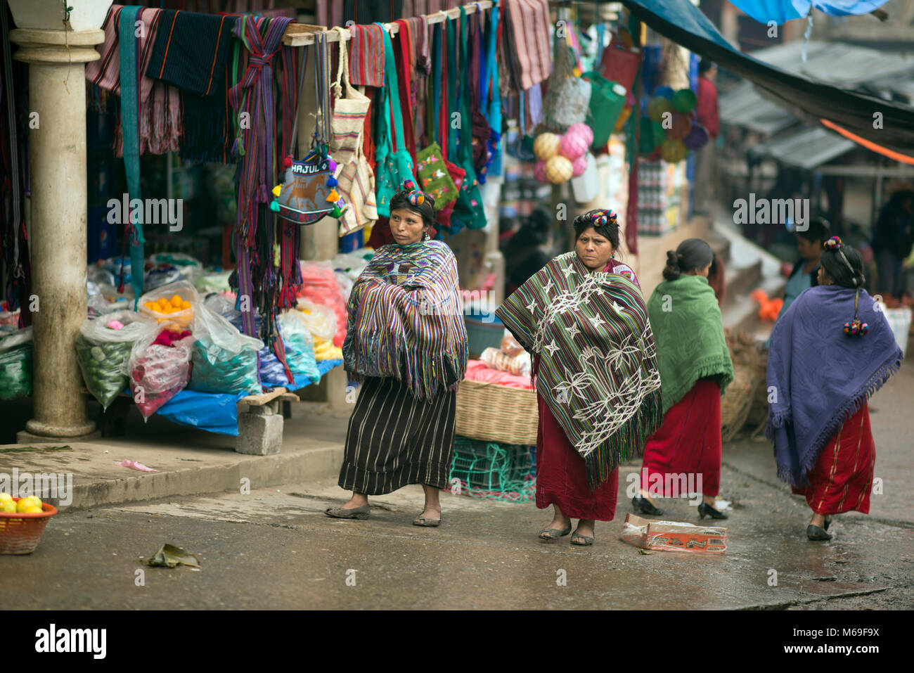 Two indigenous Ixil Maya women in colourful dress walking through the ...