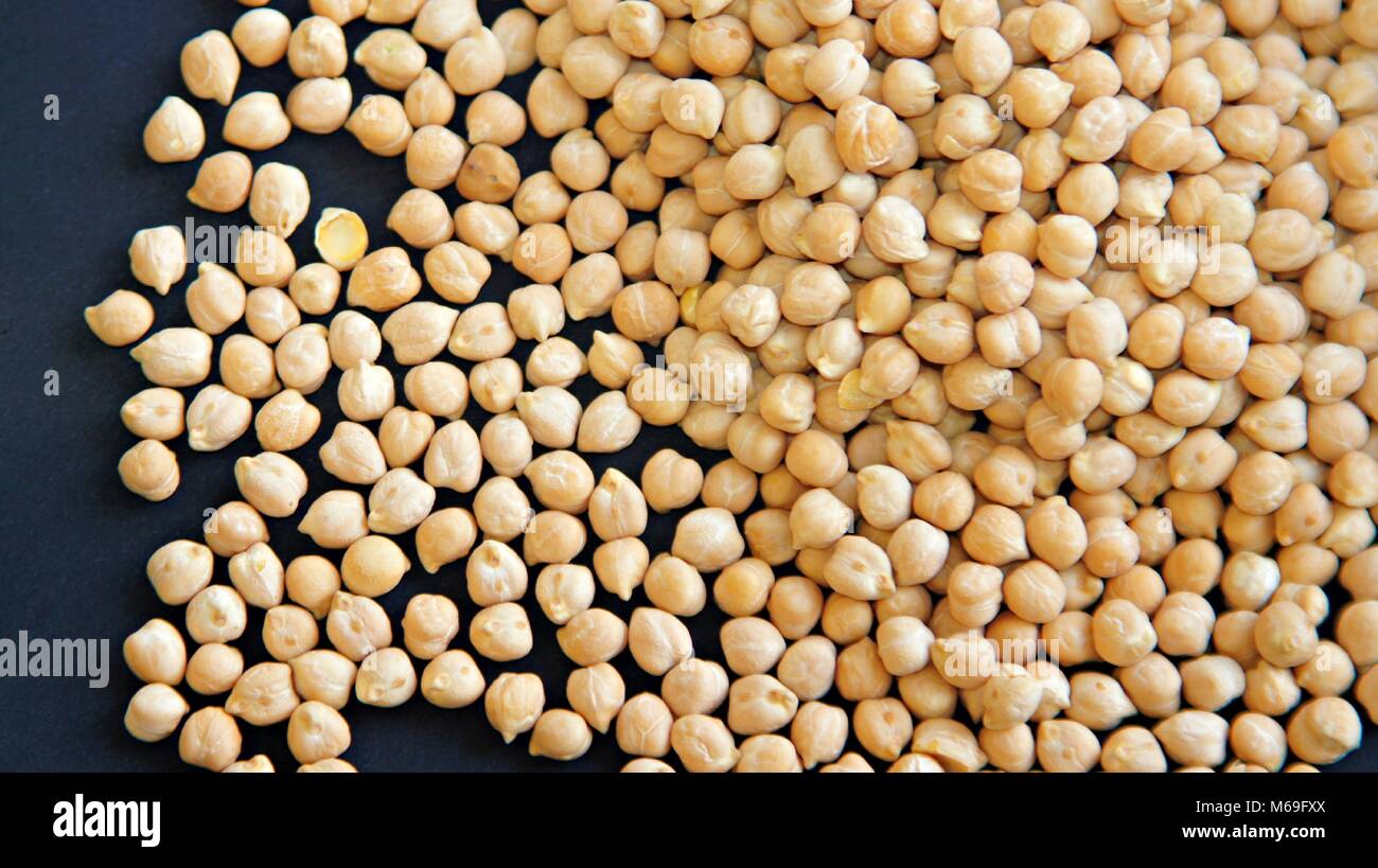 Chick Beans on a black background. Close-up Stock Photo - Alamy