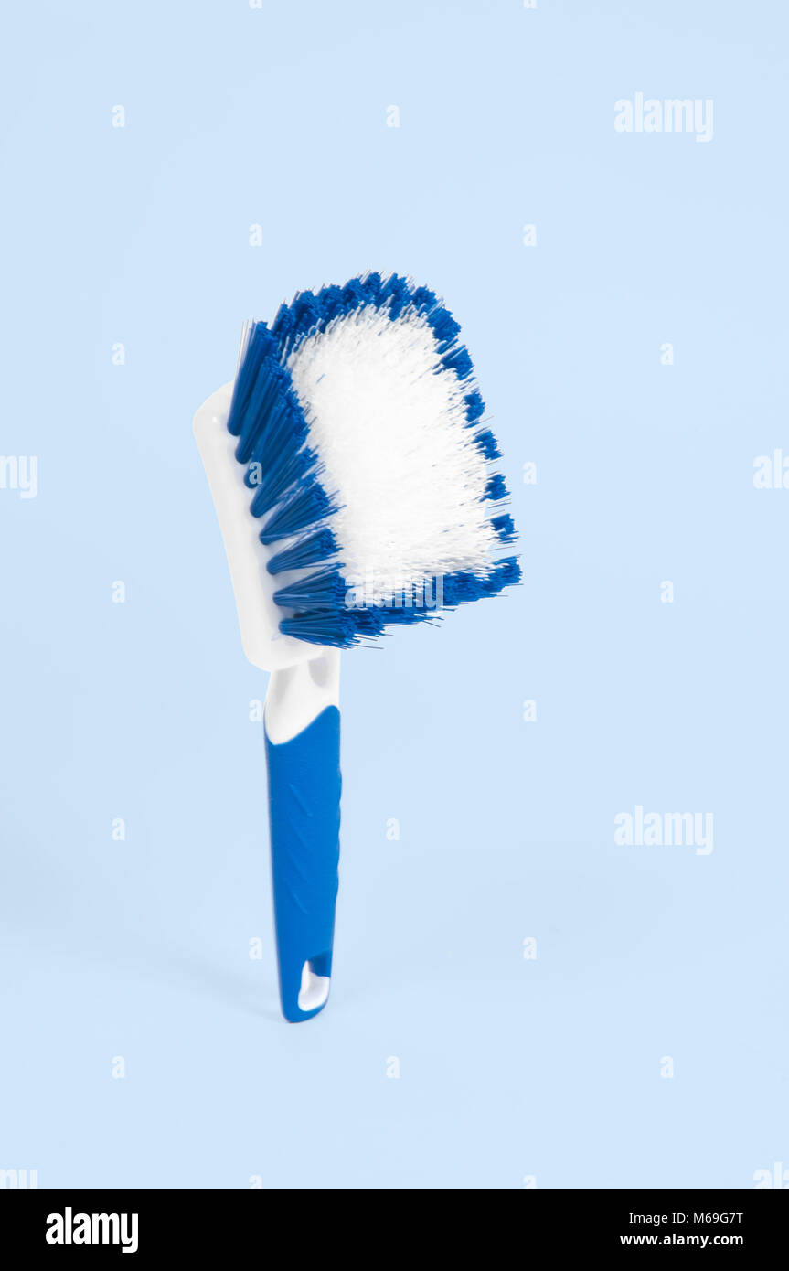 Blue brush for clean on pastel blue background Stock Photo - Alamy