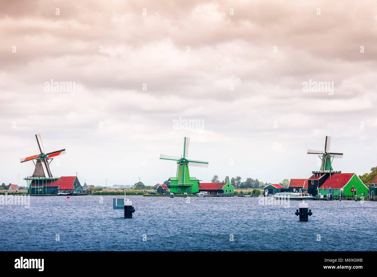 Three dutch windmills from Zaanse Schans, Amsterdam, the Netherlands ...