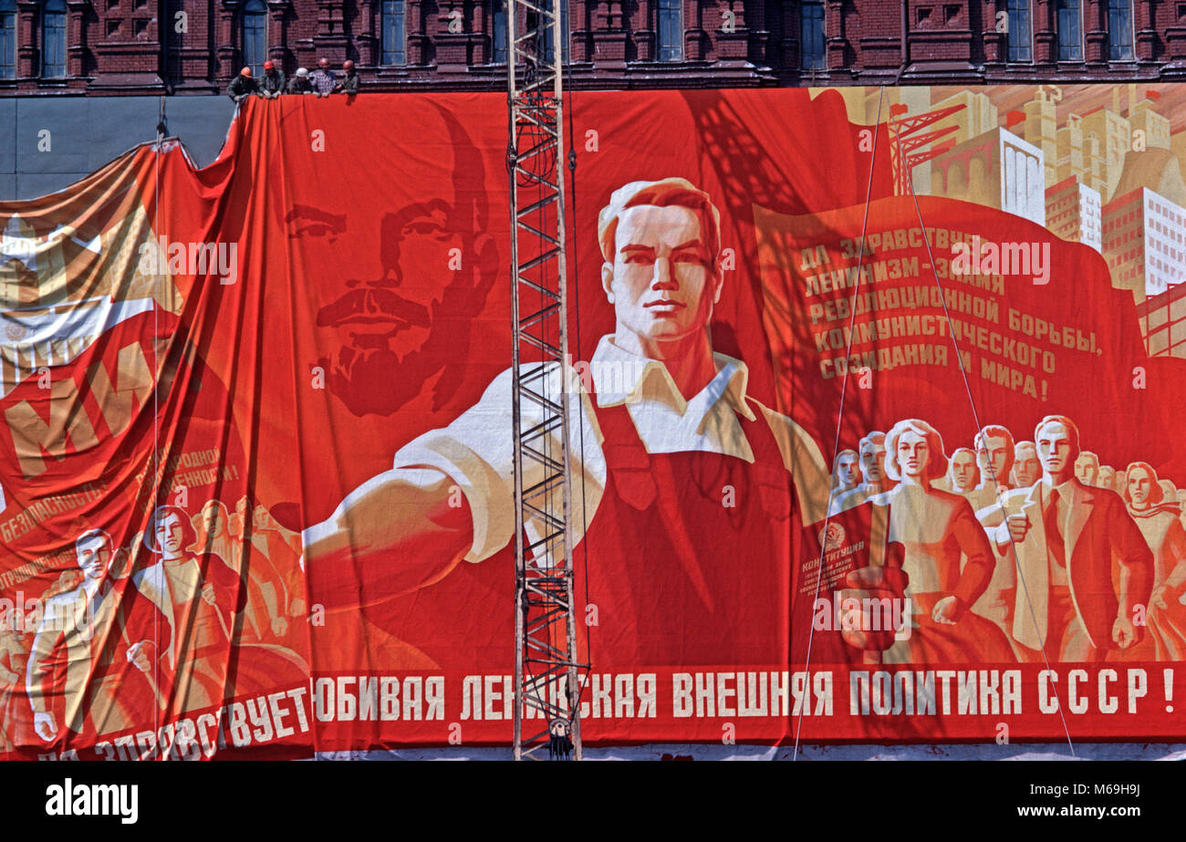 Taking down of workers political banner with portrait of Lenin ...