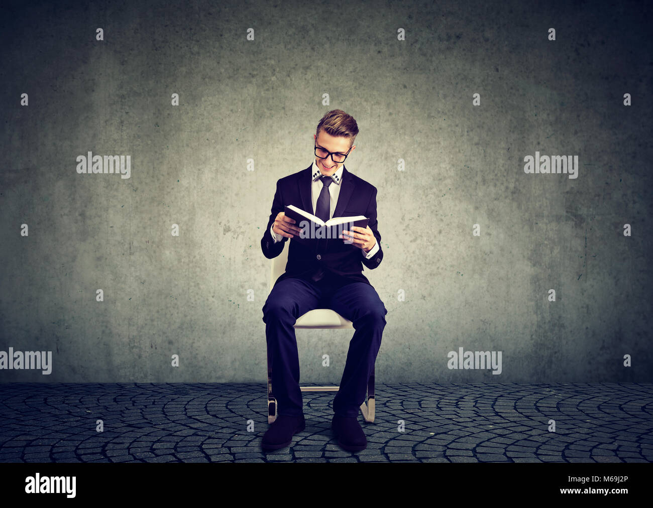Professional man with book hi-res stock photography and images - Alamy