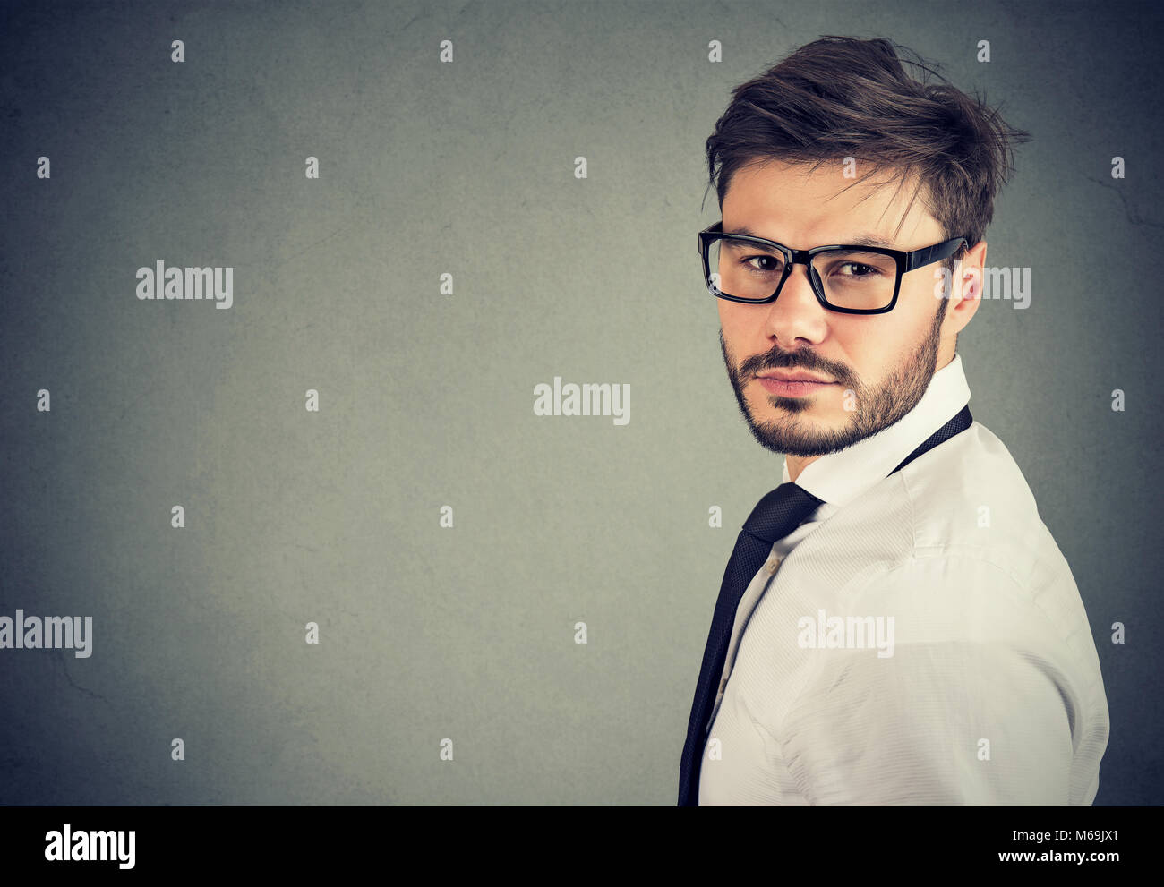 Handsome man in formal outfit and eyeglasses looking successful while ...