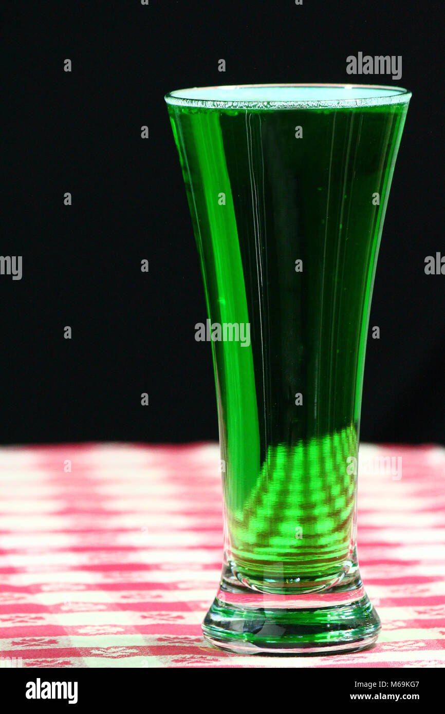 Green beer in a pilsner glass Stock Photo - Alamy