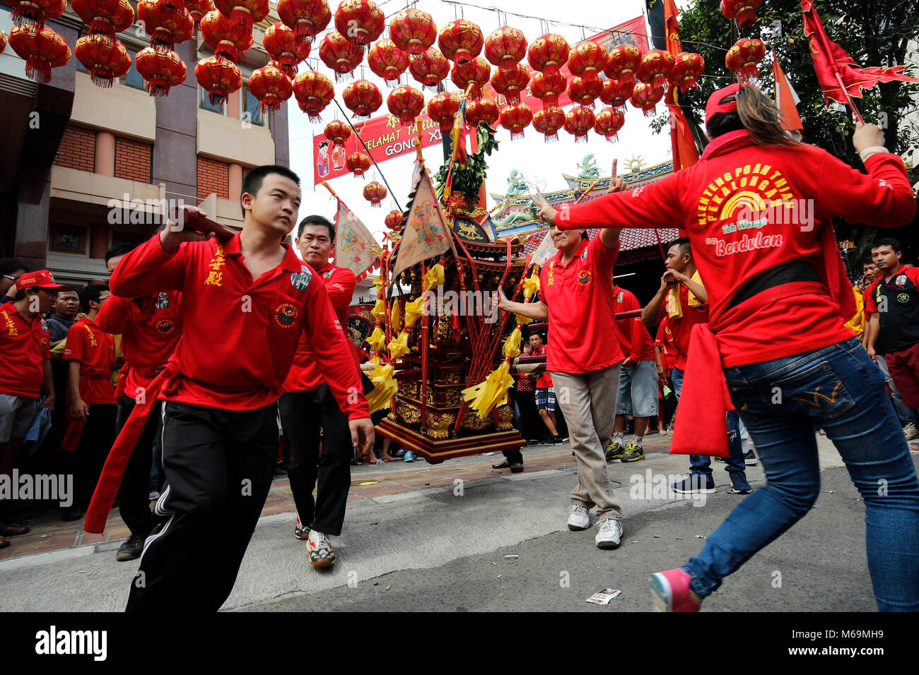 Participants shouldering God statue during “Cap Go Meh” Festival at Po ...