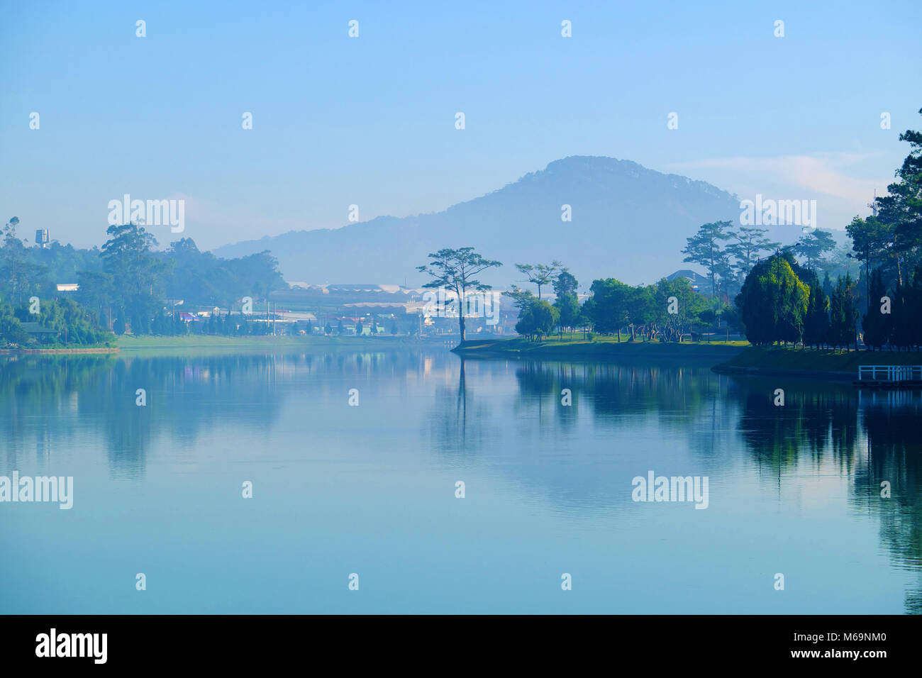 Beautiful landscapes of Da Lat city at morning with lake in fog, pine ...