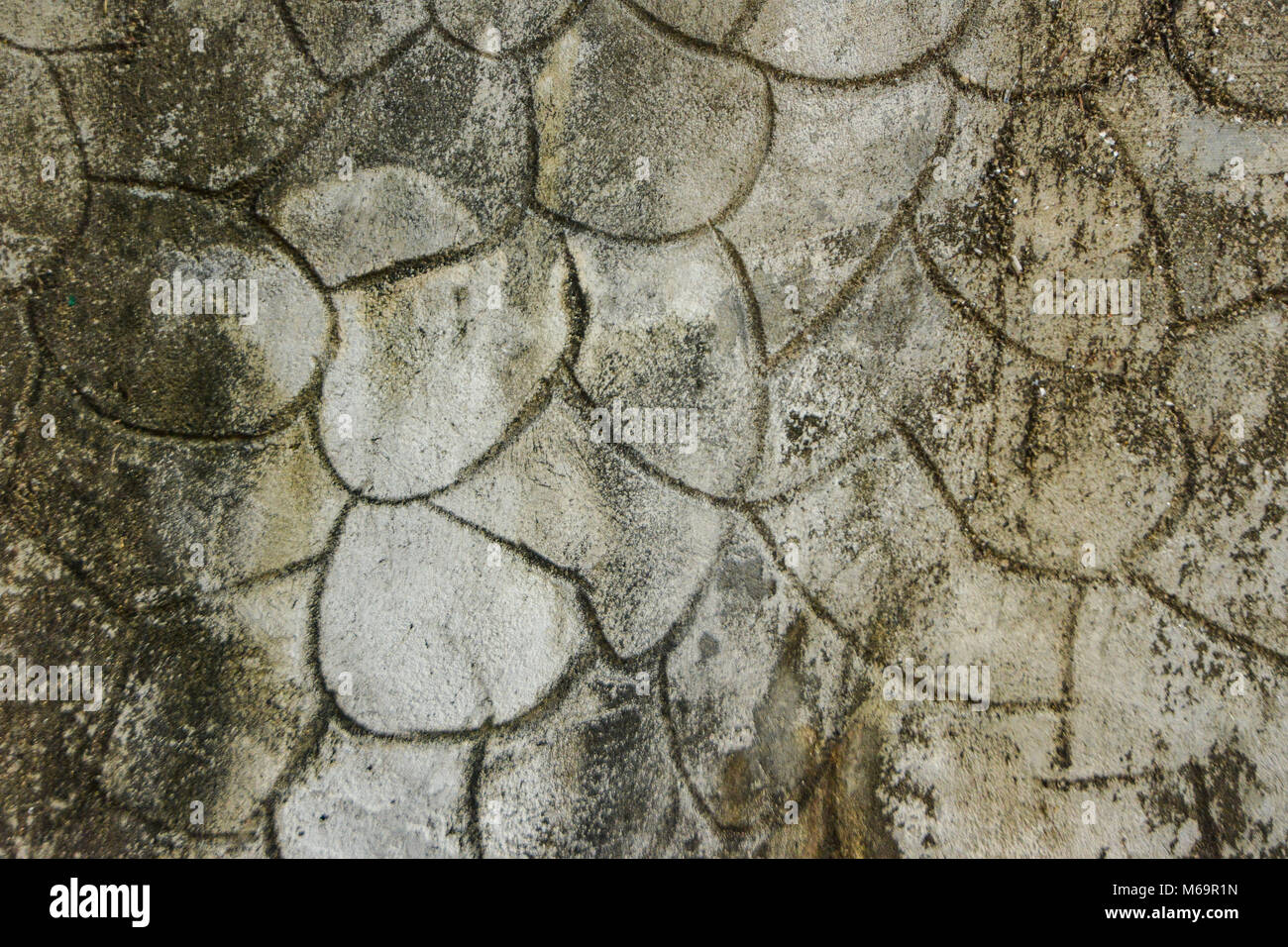 yellow patterned paving tiles on the street, top view. Cement bricks ...