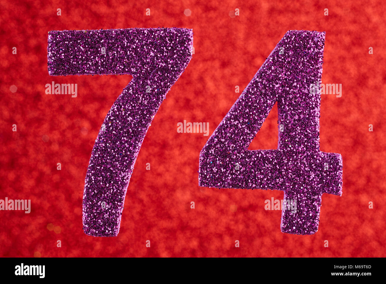 Number seventy-four purple color over a red background. Anniversary ...