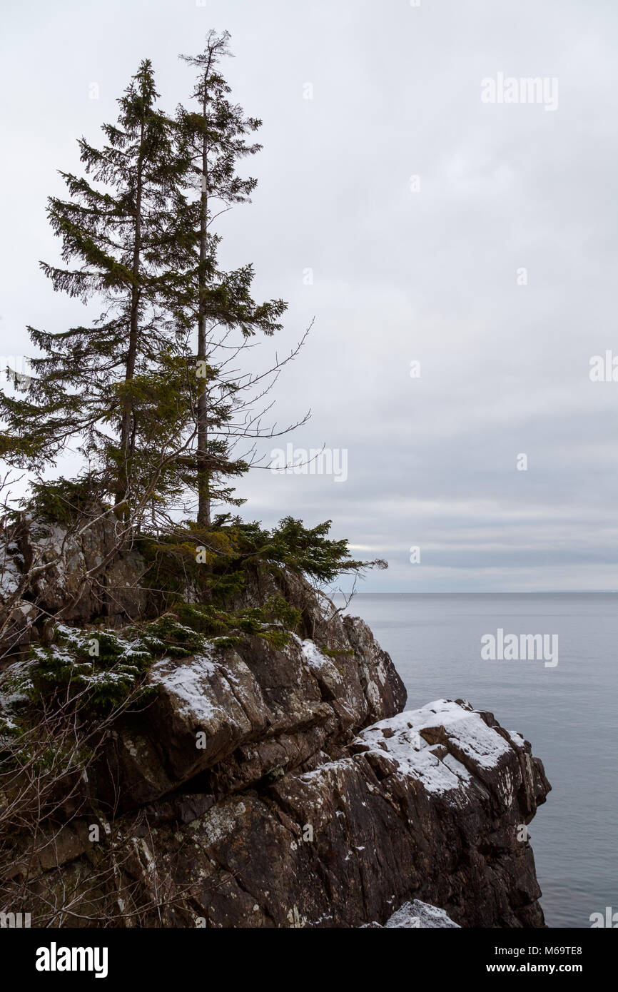 Cliffs at sea in winter with snow Stock Photo - Alamy