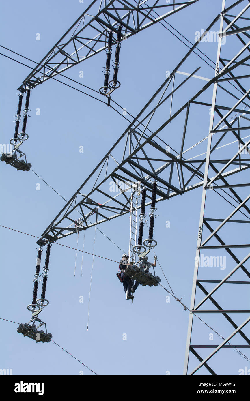 Fixing power lines 1 Stock Photo - Alamy