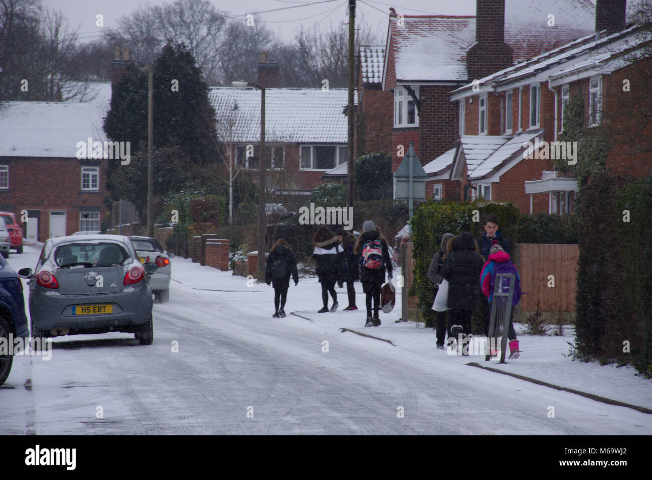 Lichfield,UK.1 March,2018.UK Weather.Beast from East.Children going to ...