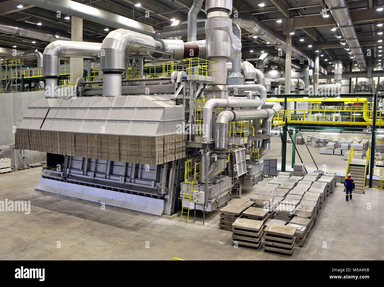 Nachterstedt, Germany. 01st Oct, 2014. A Novelis employee examines the ...