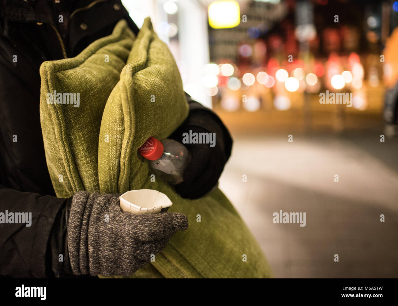 Wearing begging cup hi-res stock photography and images - Alamy