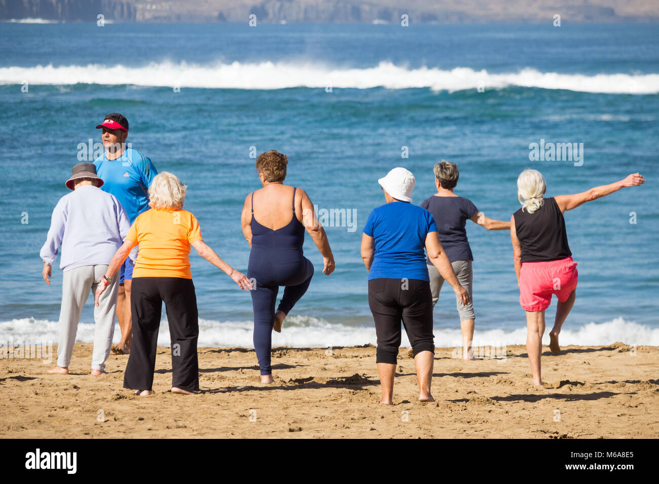 Pensioners daily keep fit class on beach in Spain Stock Photo - Alamy