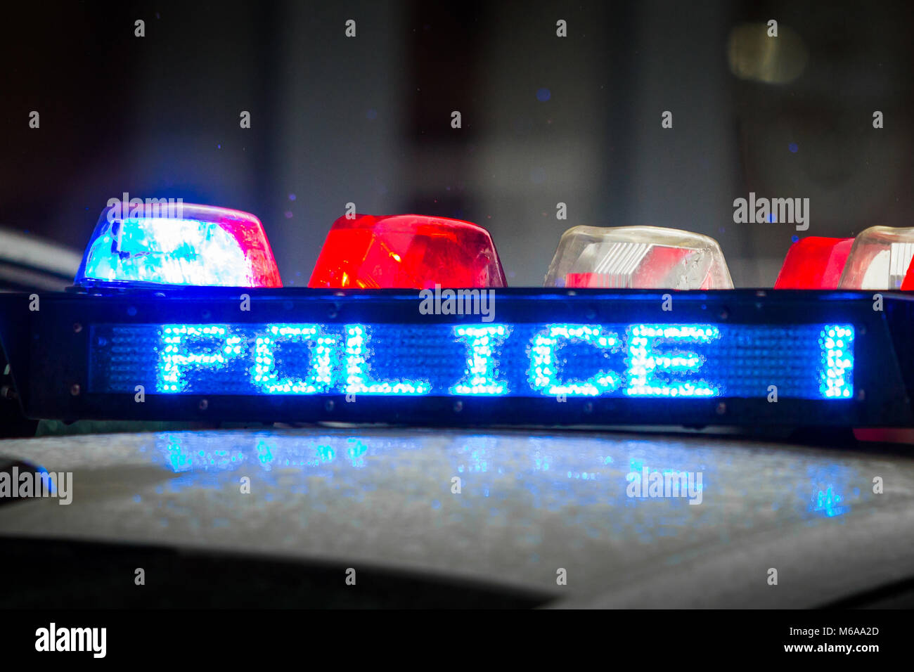 Police emergency lights with warning text close up display Stock Photo ...