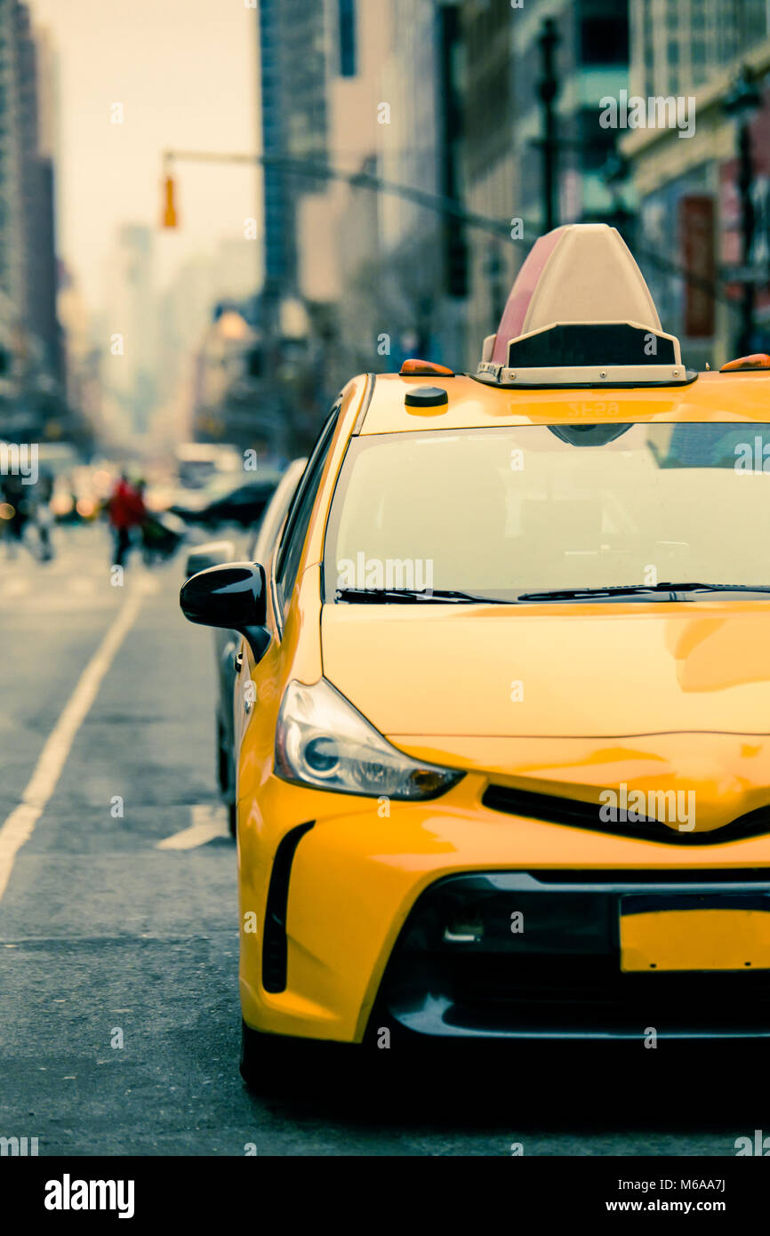 View of New York City yellow taxi cab with blurred view down street ...