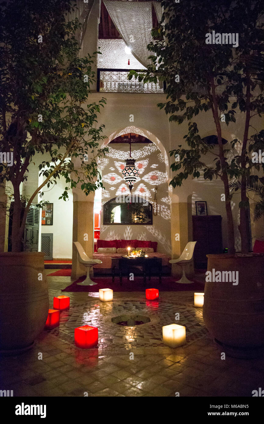 Romantic courtyard setting inside a Moroccan riad, Marrakech, Morocco ...
