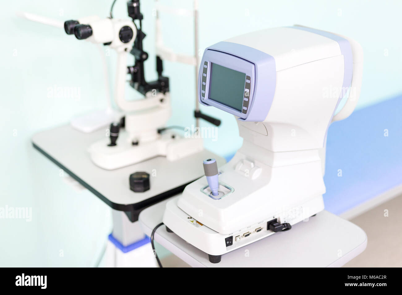 Modern ophthalmology clinic. Keratometer device measuring curvature of ...