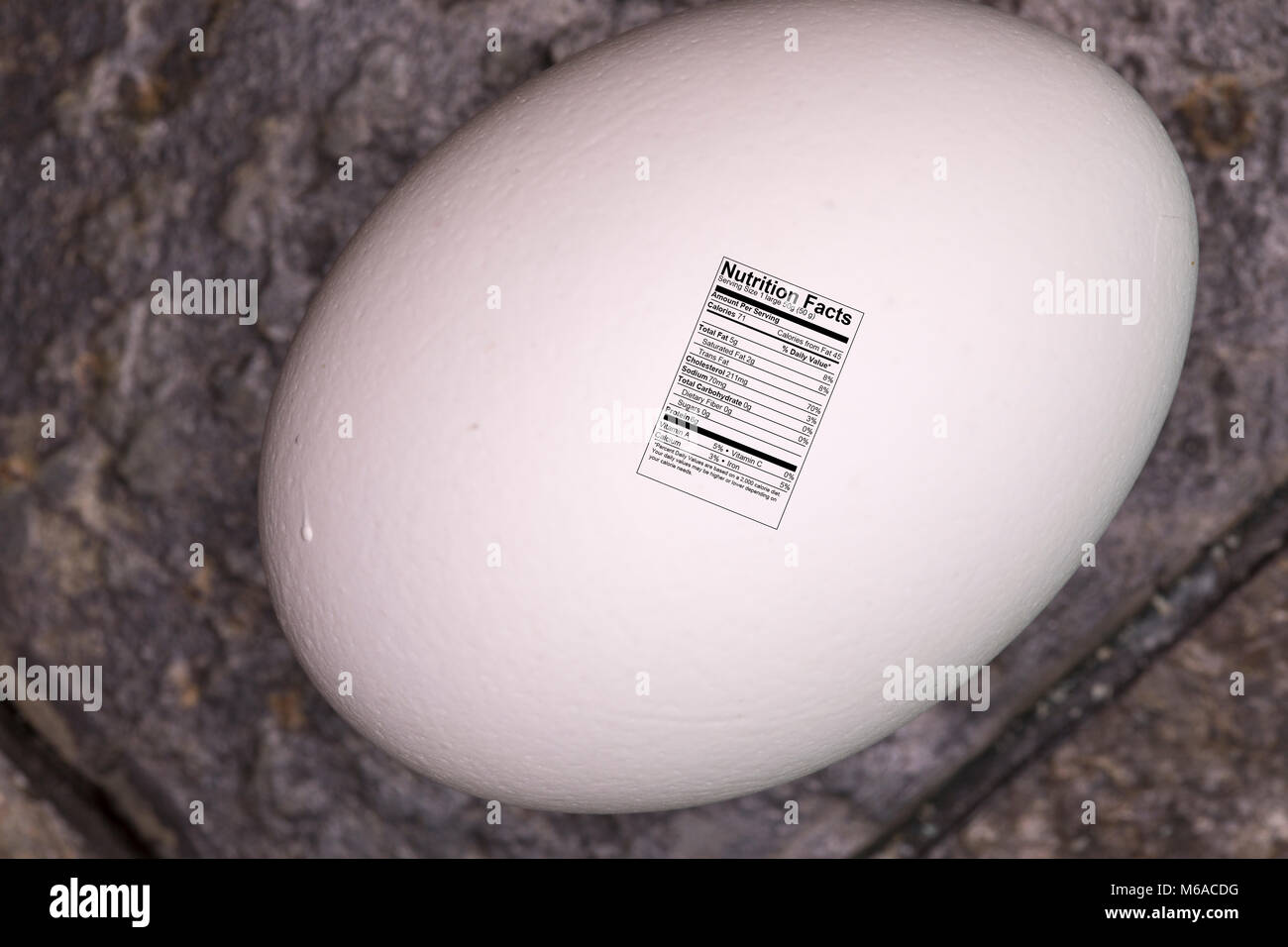 Close up of whole chicken egg with nutrition fact label Stock Photo - Alamy