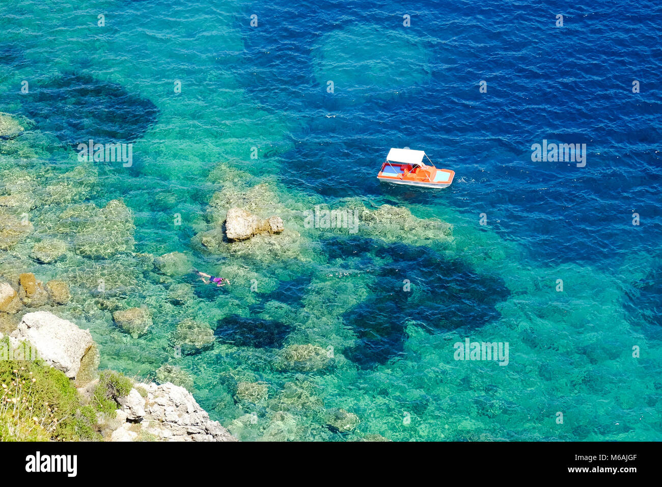 Diver doing snorkeling in the blue waters in Greece. Corfu island ...