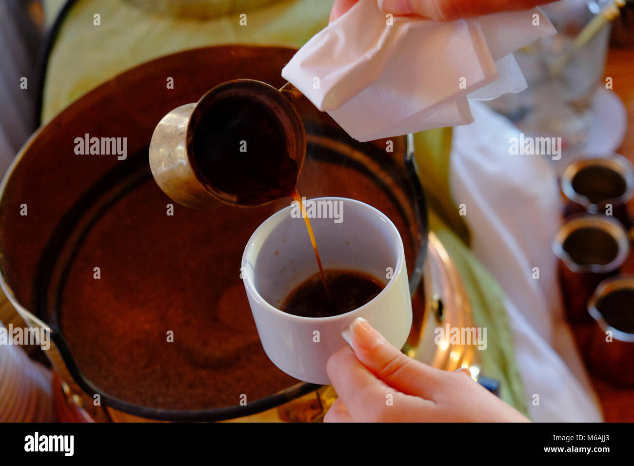 Making traditional greek / turkish black coffee on sand Stock Photo - Alamy