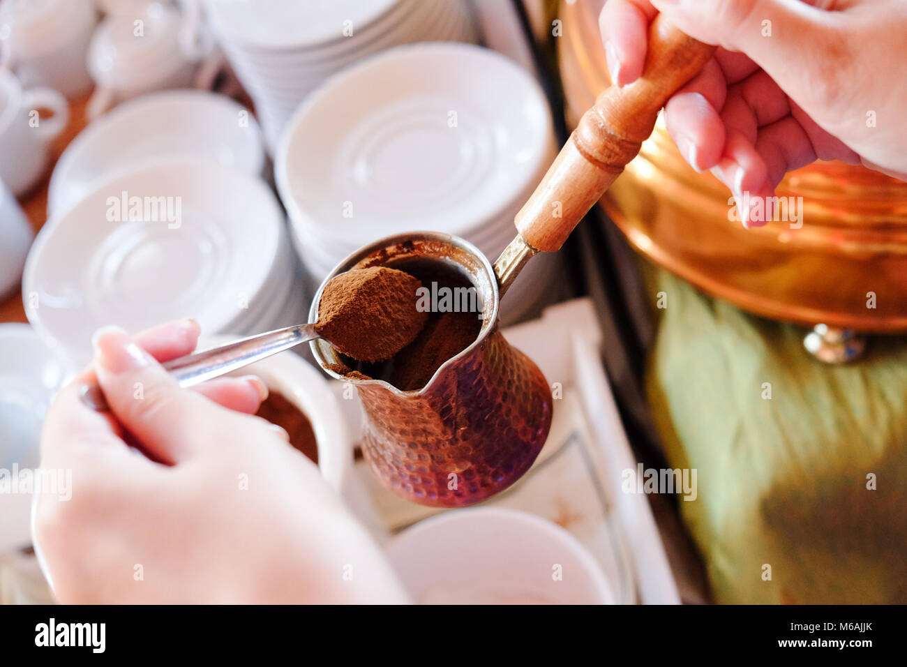 Making traditional greek / turkish black coffee on sand Stock Photo - Alamy
