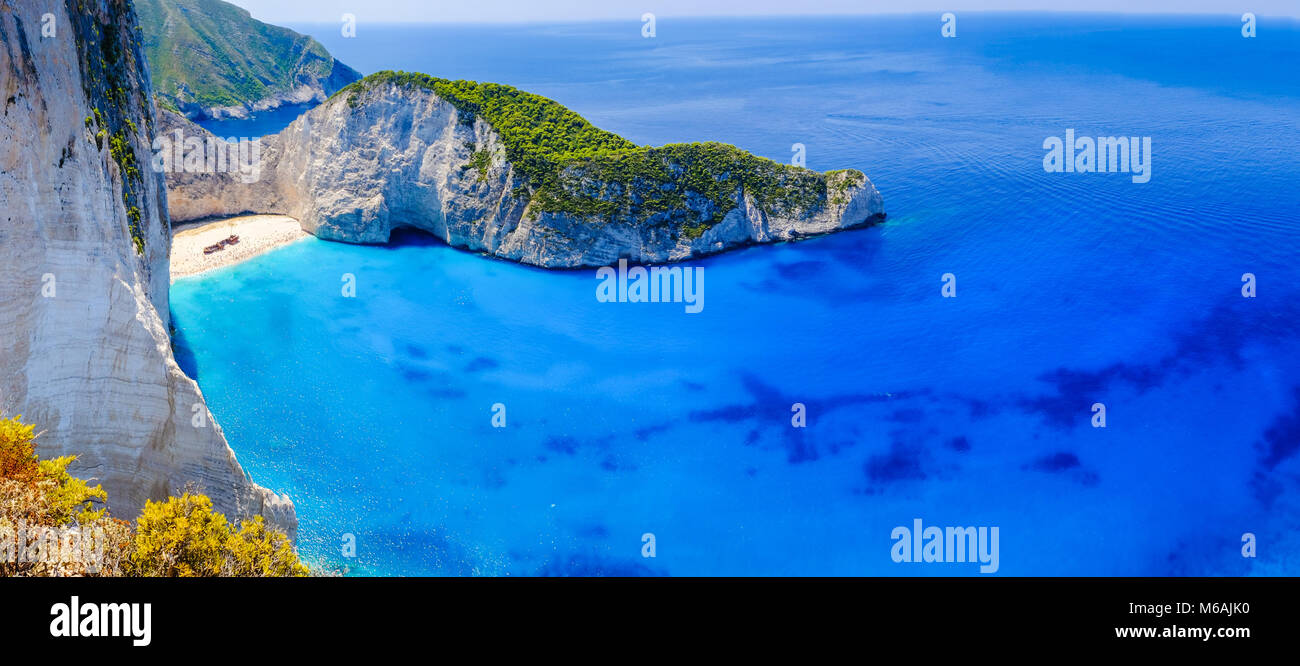 Zakynthos shipwreck beach. Navagio Bay panorama with boats and clear ...