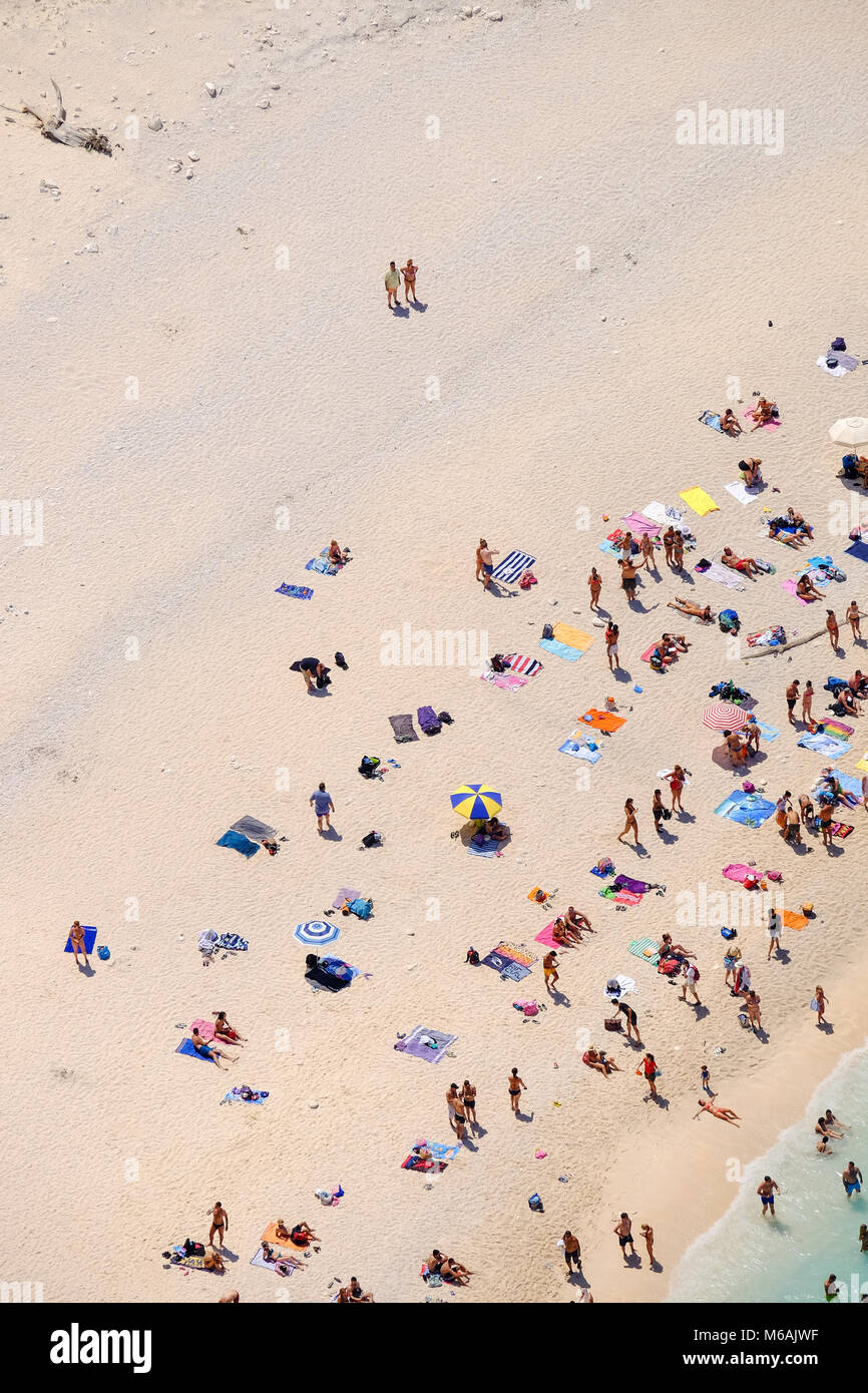 Couple sun bathing beach hi-res stock photography and images - Alamy