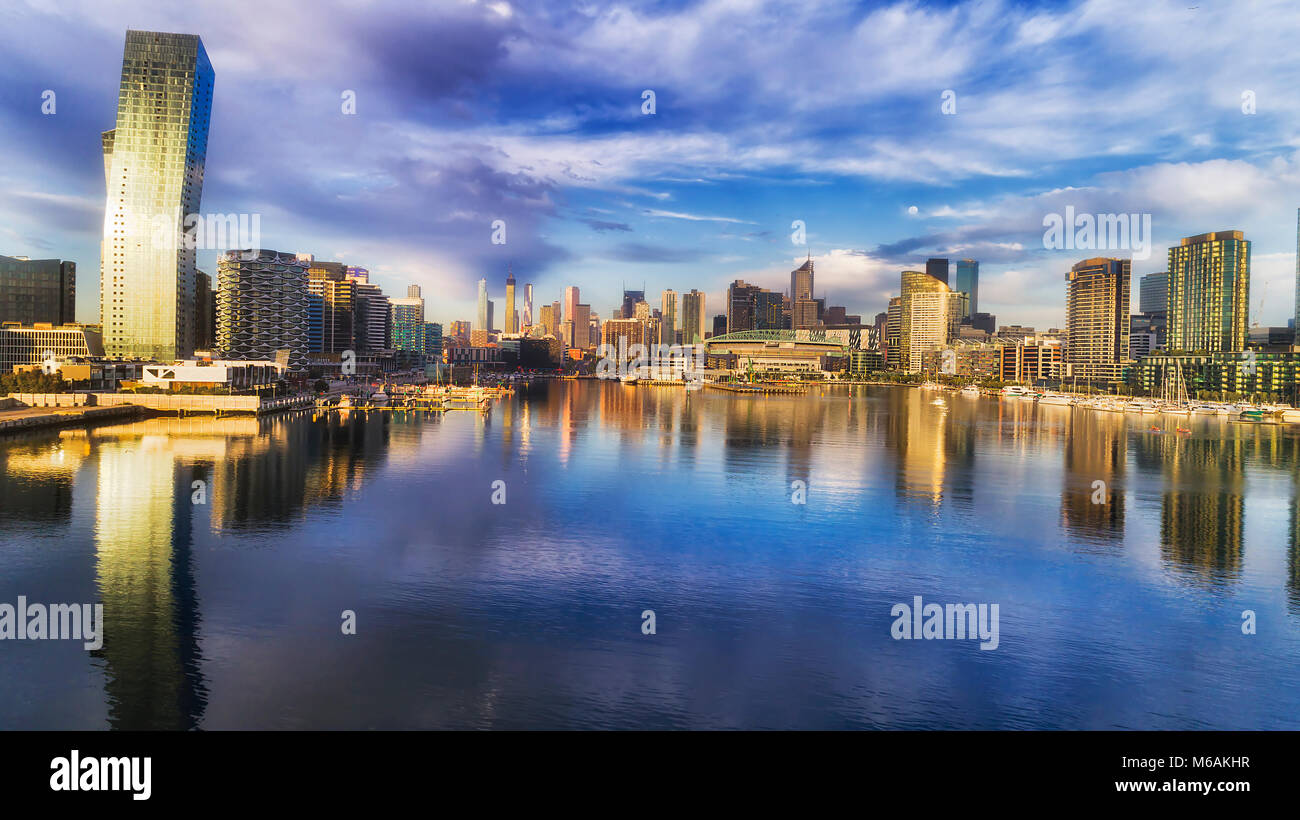 Still Yarra river bay water reflects modern urban architecture of ...