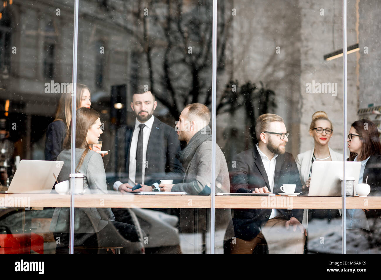 View through the window on the business people indoors Stock Photo - Alamy