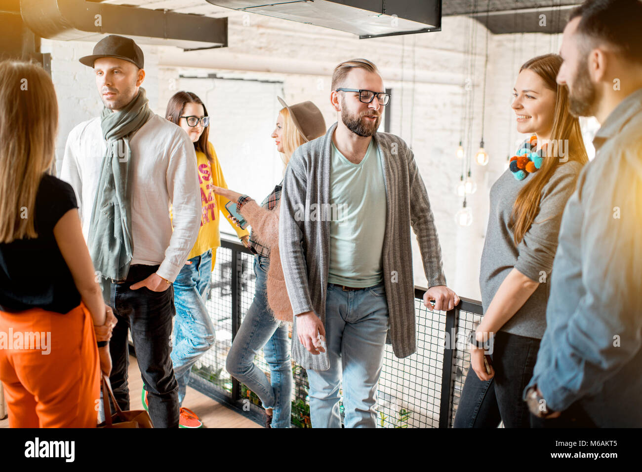 Friends talking during the break in the conference hall Stock Photo - Alamy